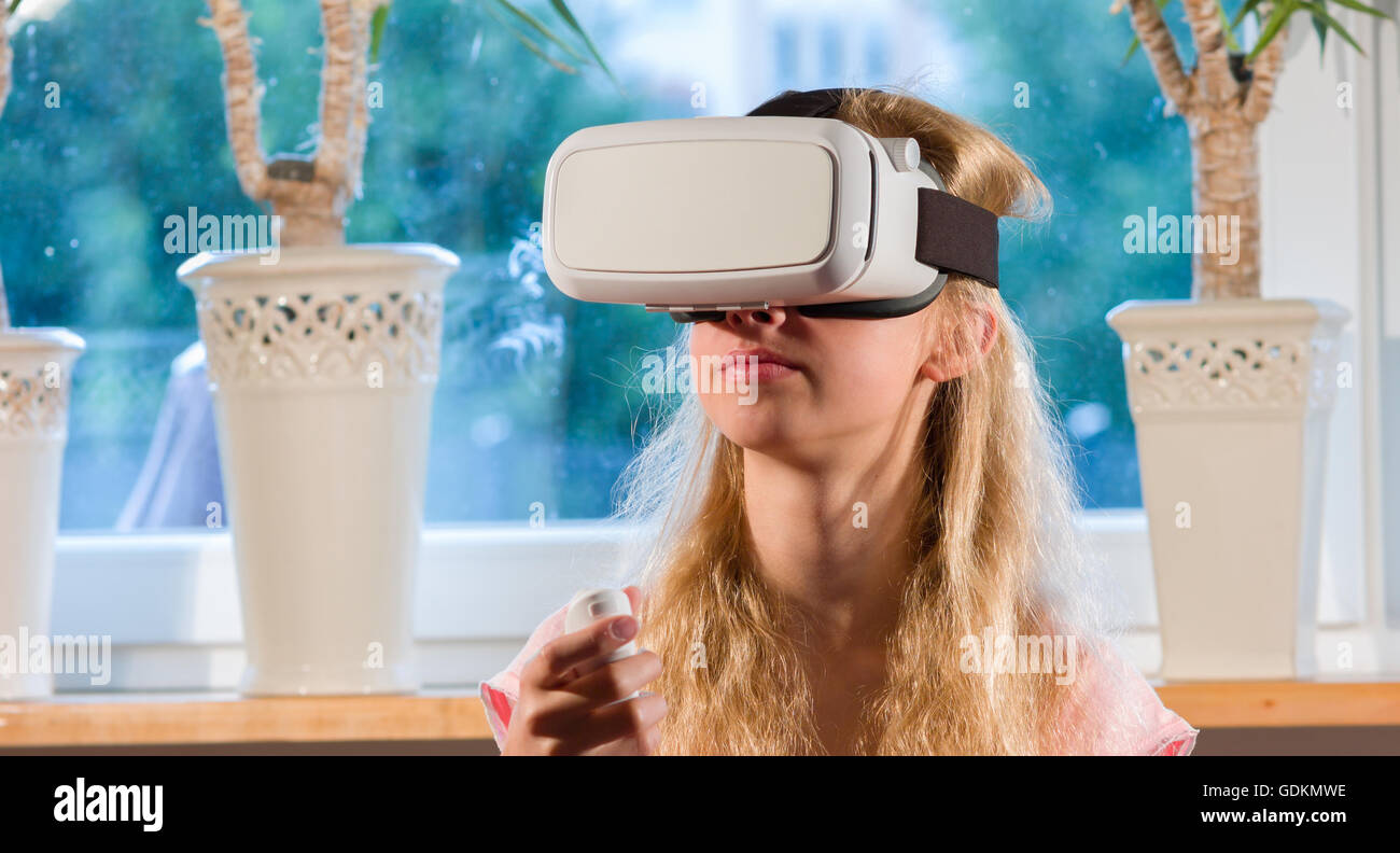 Young girl having fun with VR headset Stock Photo - Alamy