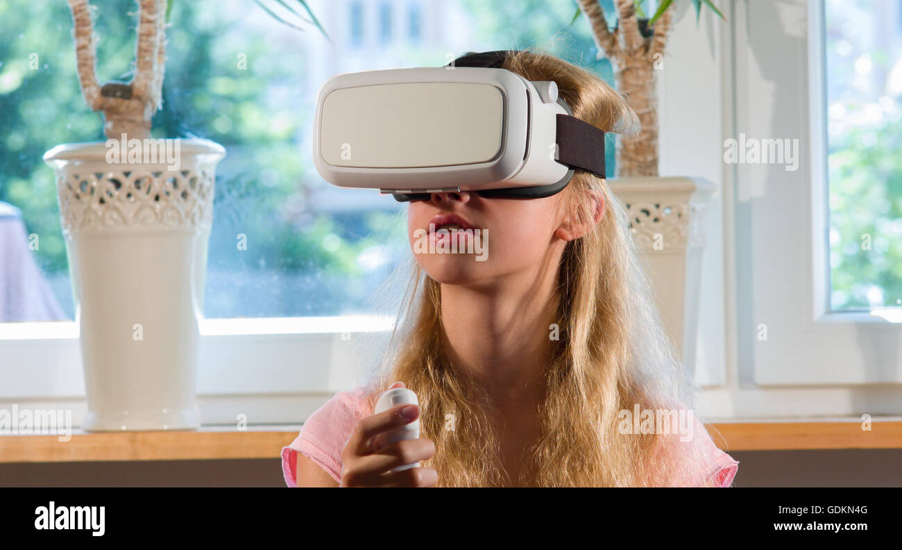 Girl wearing virtual reality glasses Stock Photo - Alamy