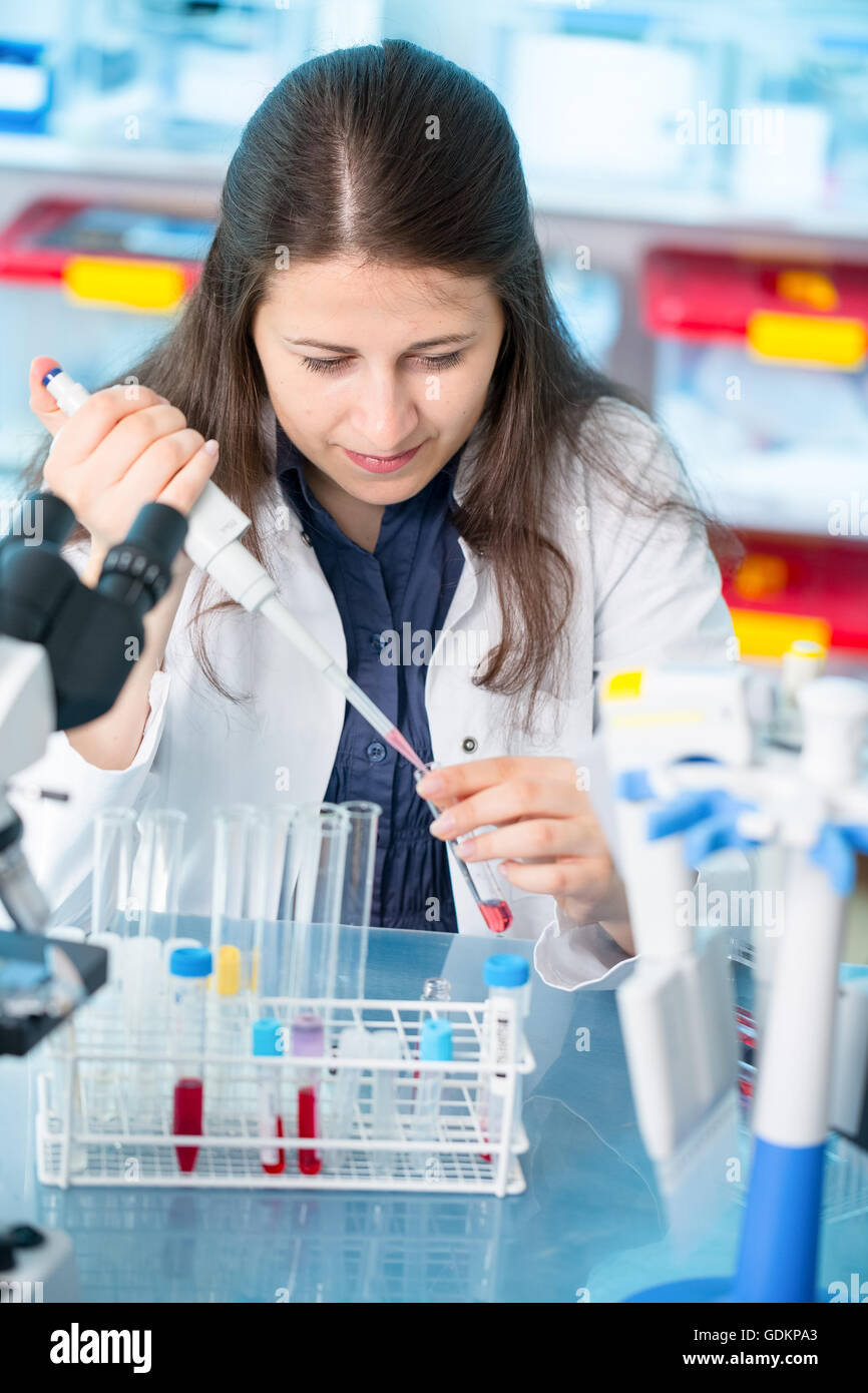 technician in the laboratory with a pipette and test tube Stock Photo ...