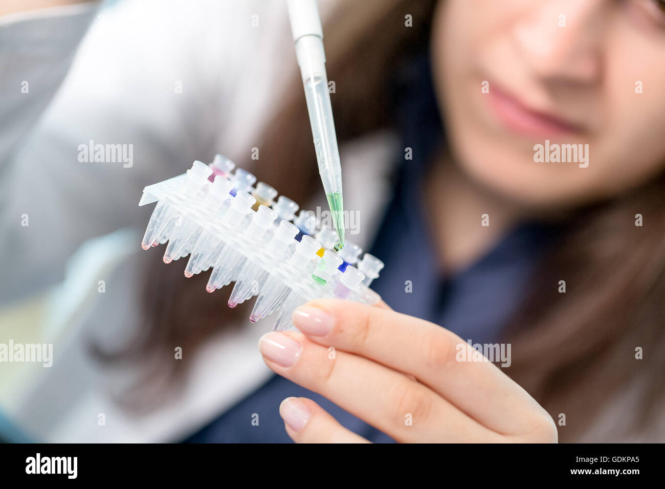 technician in the laboratory with a pipette and test tube Stock Photo ...