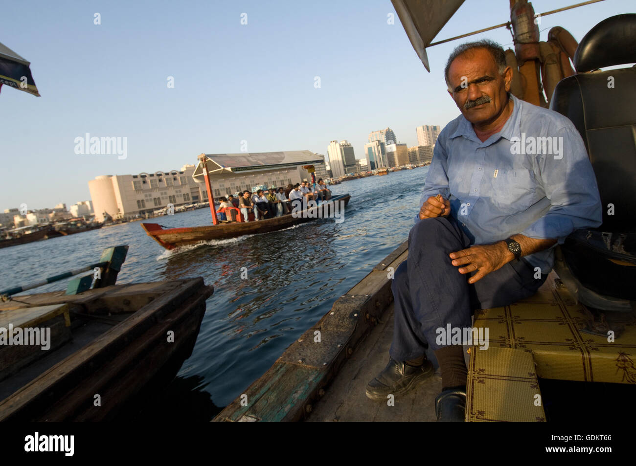A man sitting in an abra, Dubai, UAE Stock Photo - Alamy