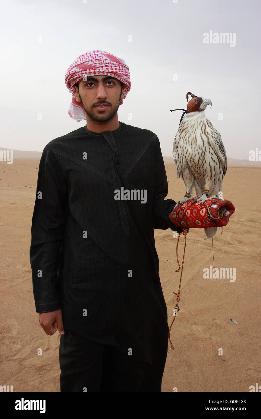 Arab man holding falcon dubai hi-res stock photography and images - Alamy