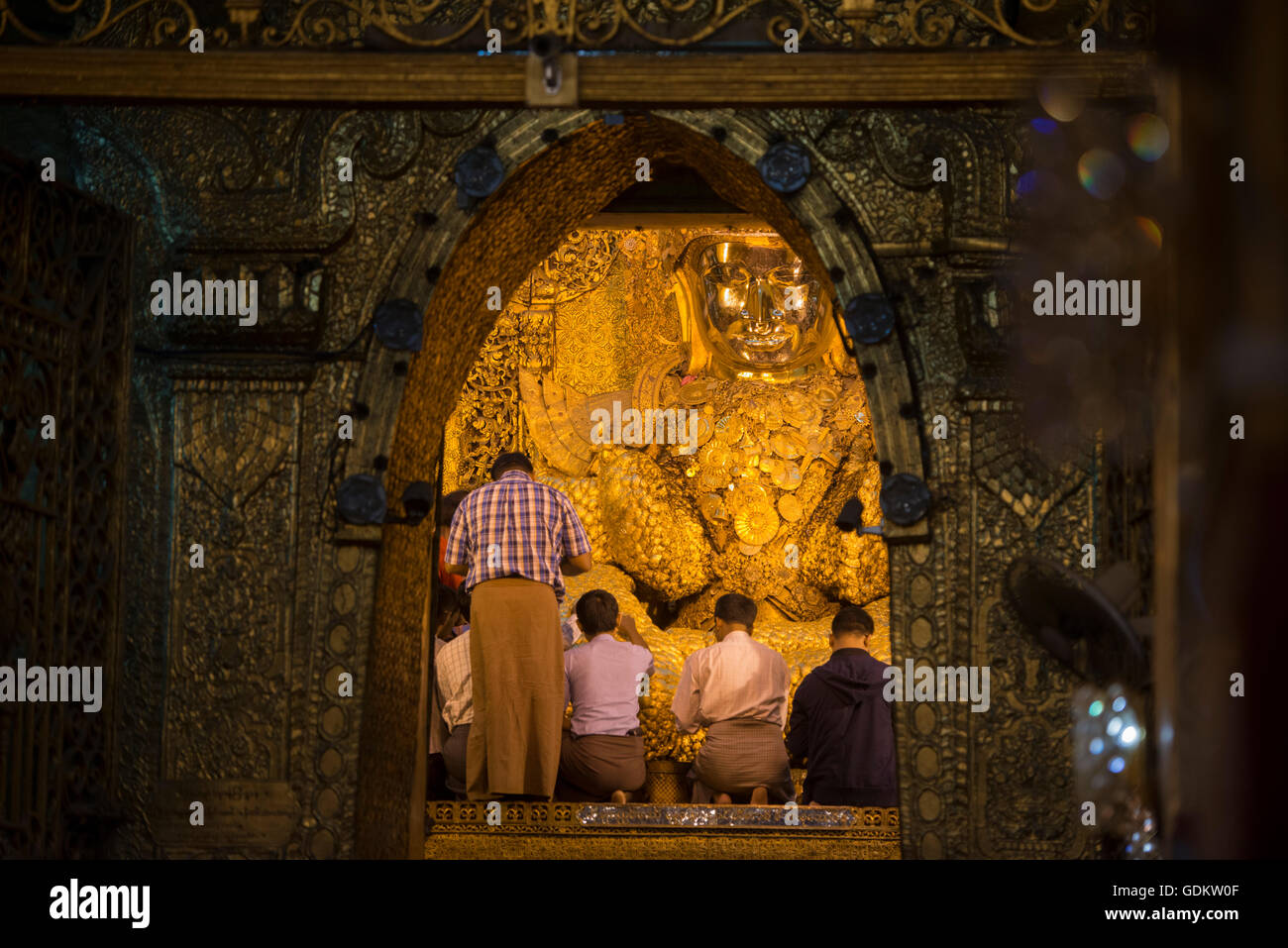 The Mahamuni Buddha at the Mahamuni temple in the City of Mandalay in ...