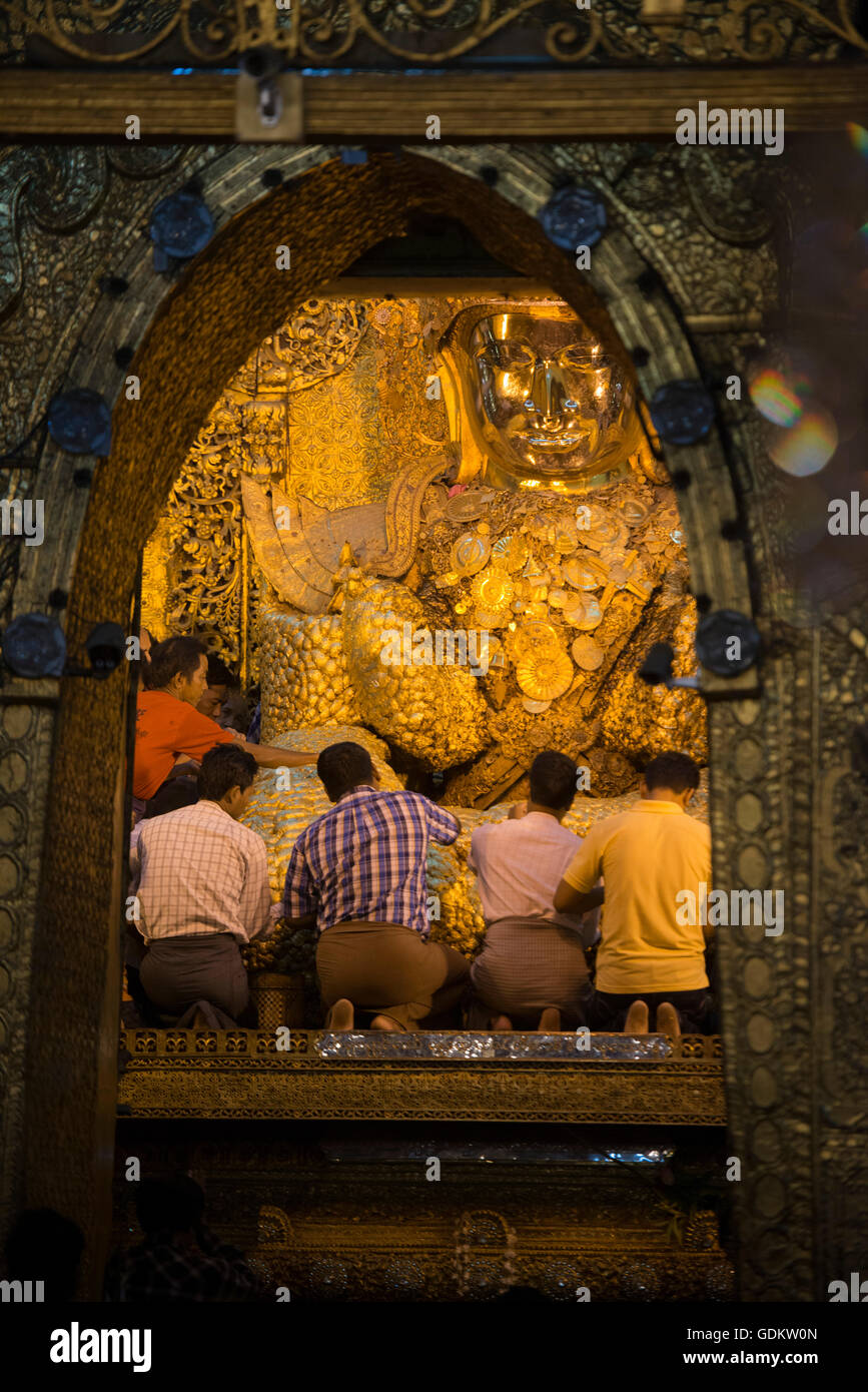 The Mahamuni Buddha at the Mahamuni temple in the City of Mandalay in ...
