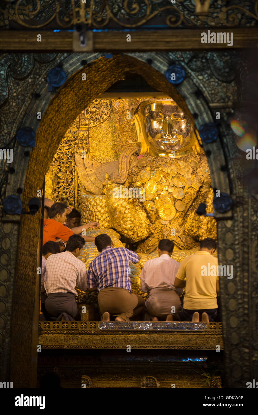 The Mahamuni Buddha at the Mahamuni temple in the City of Mandalay in ...