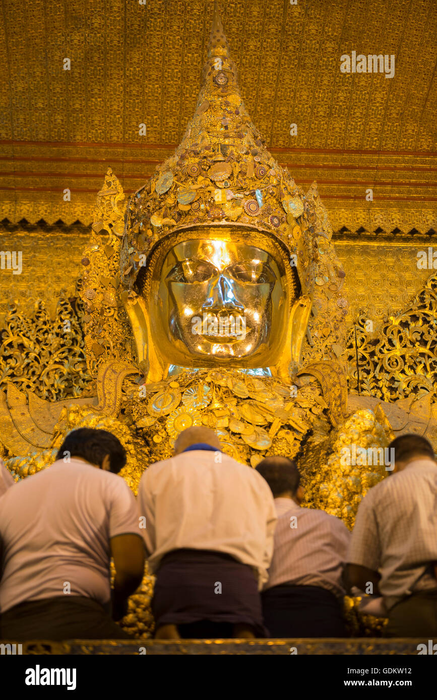 The Mahamuni Buddha at the Mahamuni temple in the City of Mandalay in ...