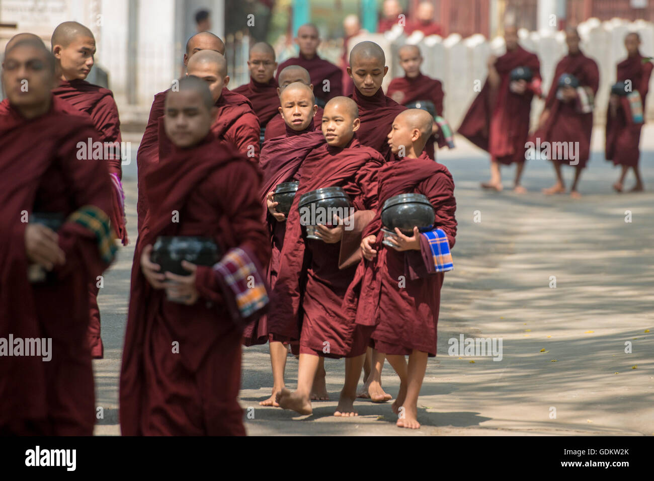monks are on the way to the lunch at the Mahagandayon Monastery in ...