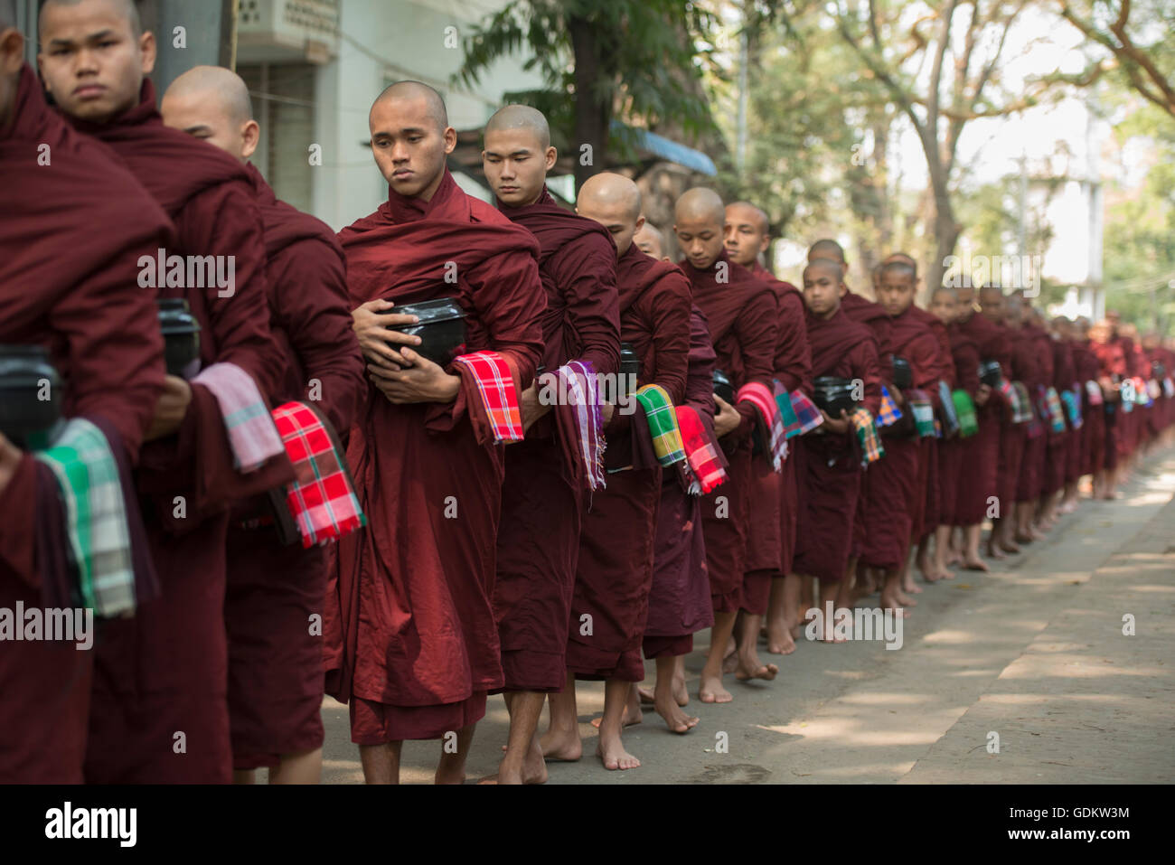 monks are on the way to the lunch at the Mahagandayon Monastery in ...