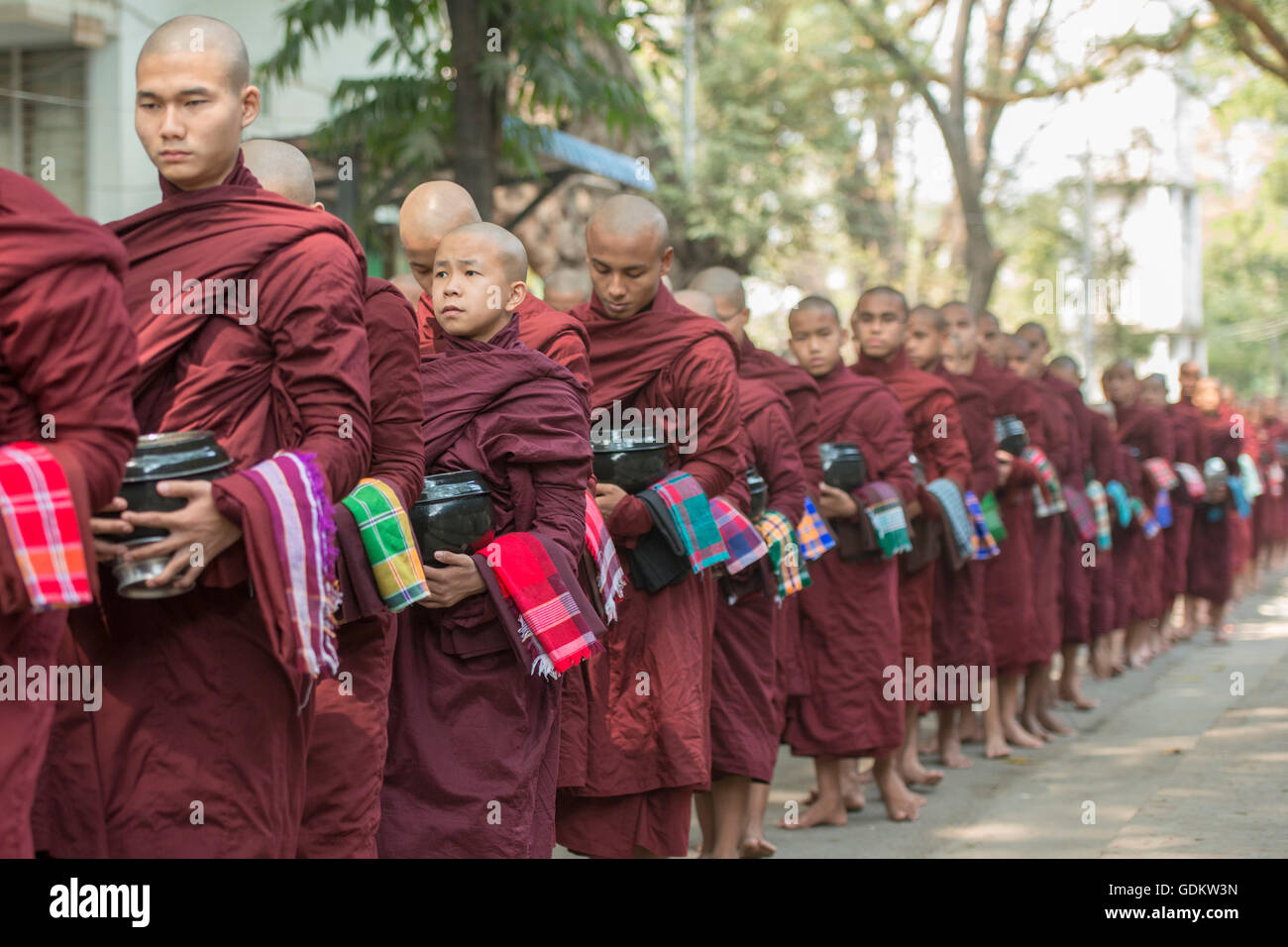 monks are on the way to the lunch at the Mahagandayon Monastery in ...