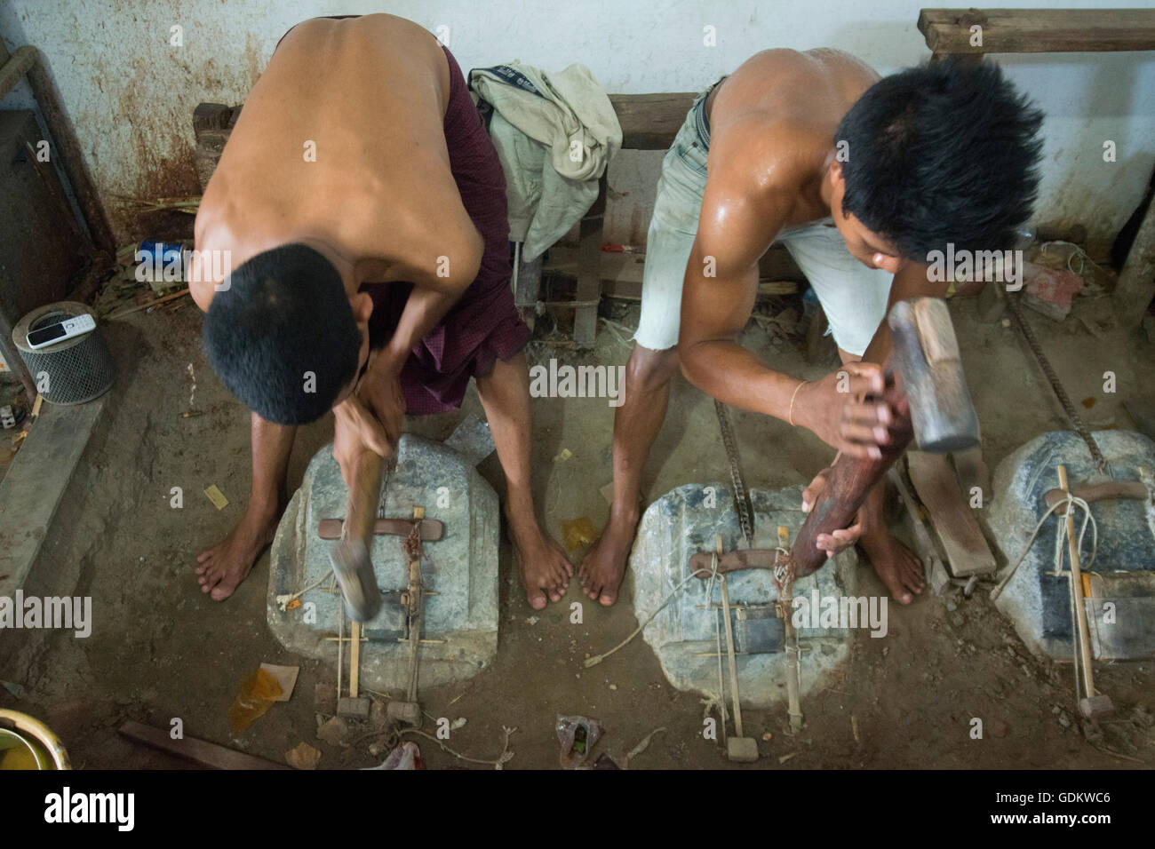 workers pound sheets of Gold leaf at a Gold pounder Factory the City of ...