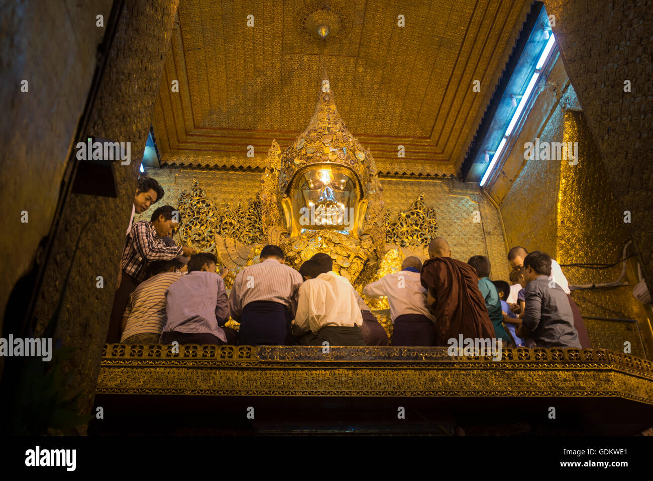 The Mahamuni Buddha at the Mahamuni temple in the City of Mandalay in ...