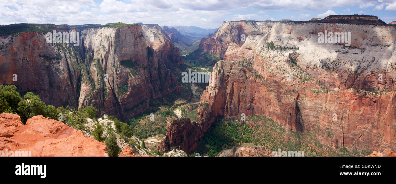 perched atop the highest peak looking down at the canyon's below Stock ...