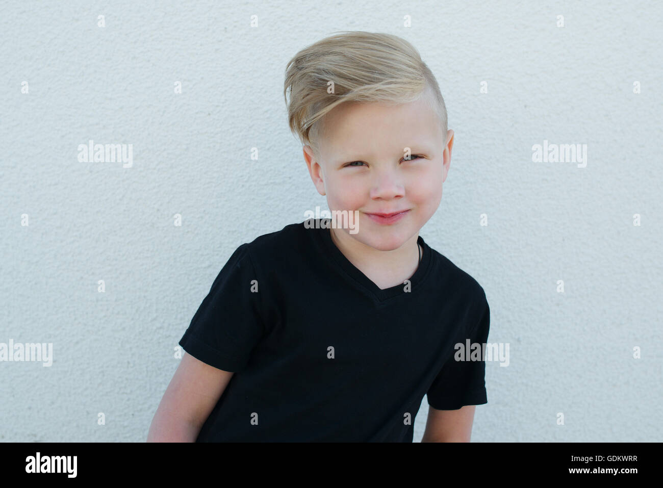 young emotional boy on bright background Stock Photo - Alamy