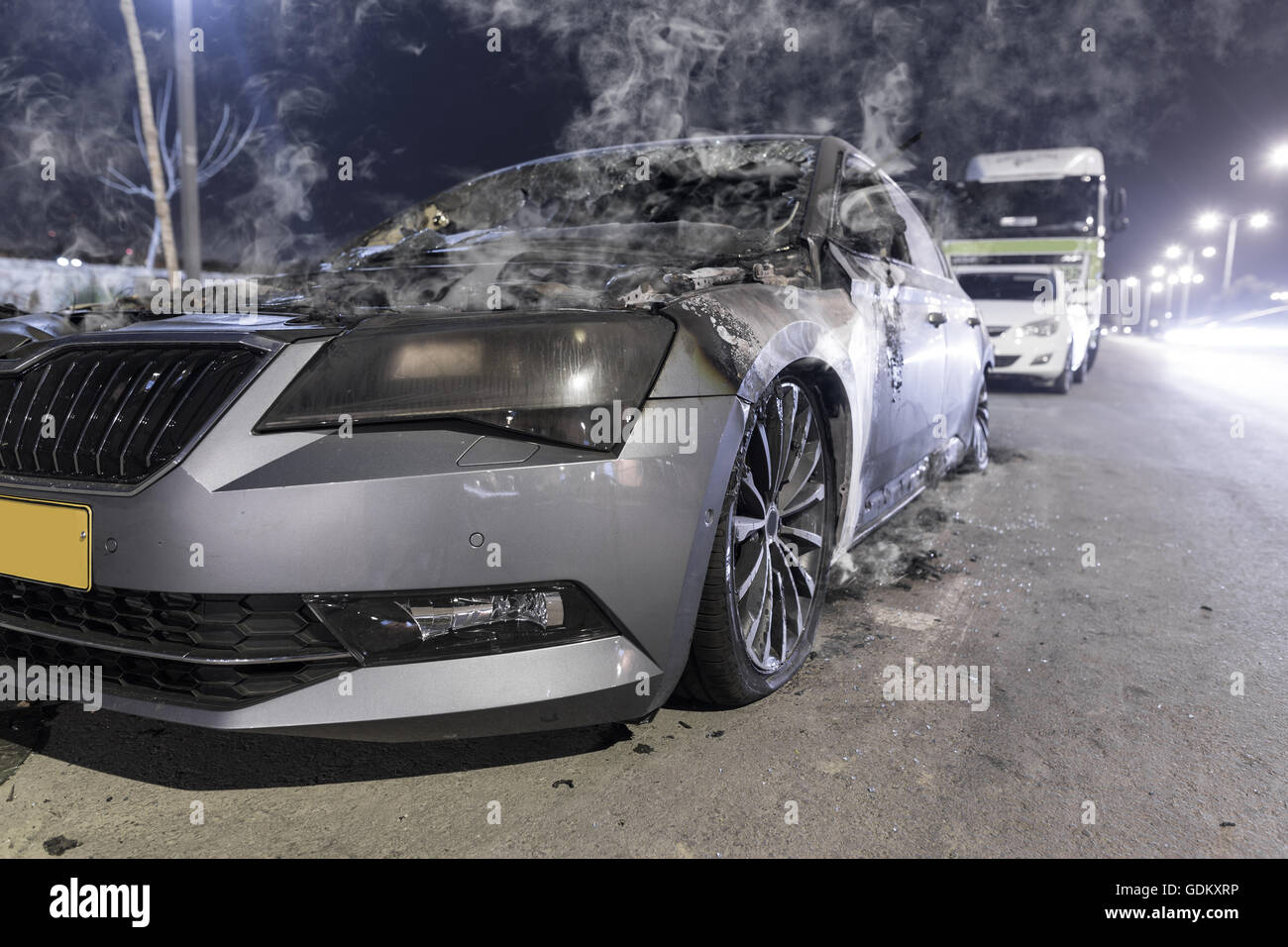 road and transport incident, a broken steaming car Stock Photo - Alamy