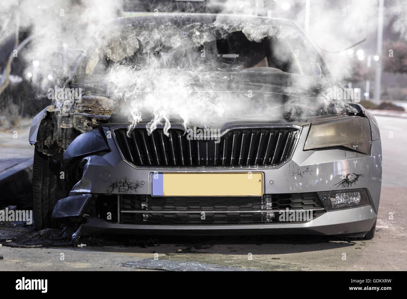 road and transport incident, a broken steaming car Stock Photo - Alamy