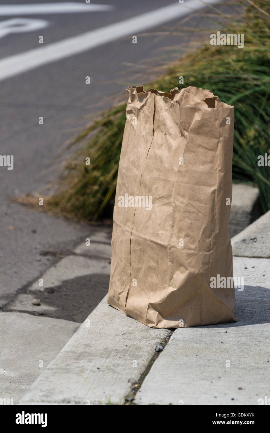 A paper bag in the street in a sunny day Stock Photo - Alamy