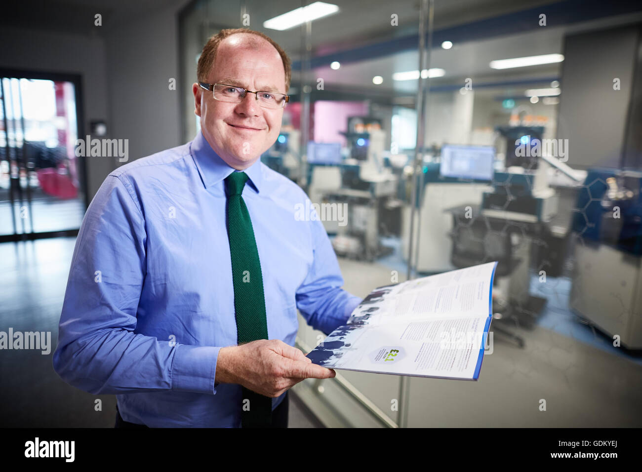 George Freeman MP science lab background Stock Photo - Alamy