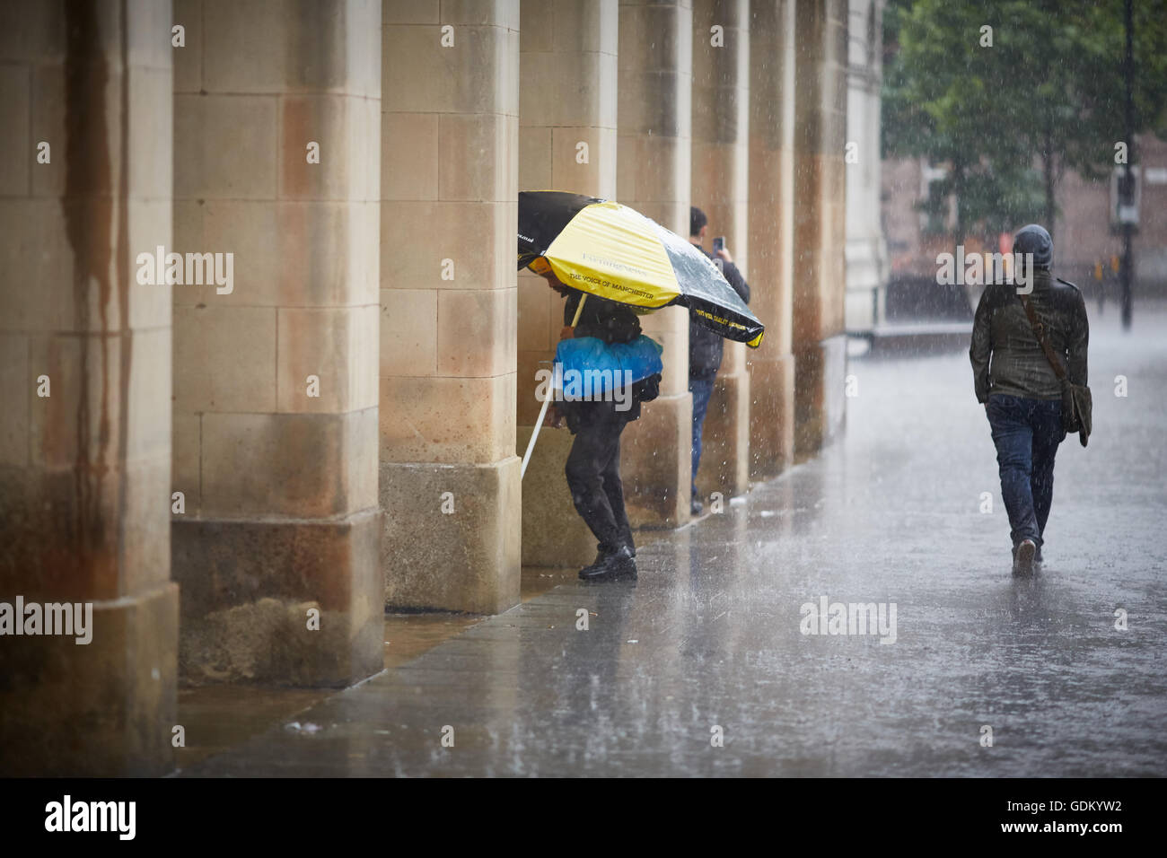 Heavy rain in Manchester city centre raining down pour wet soaked ...