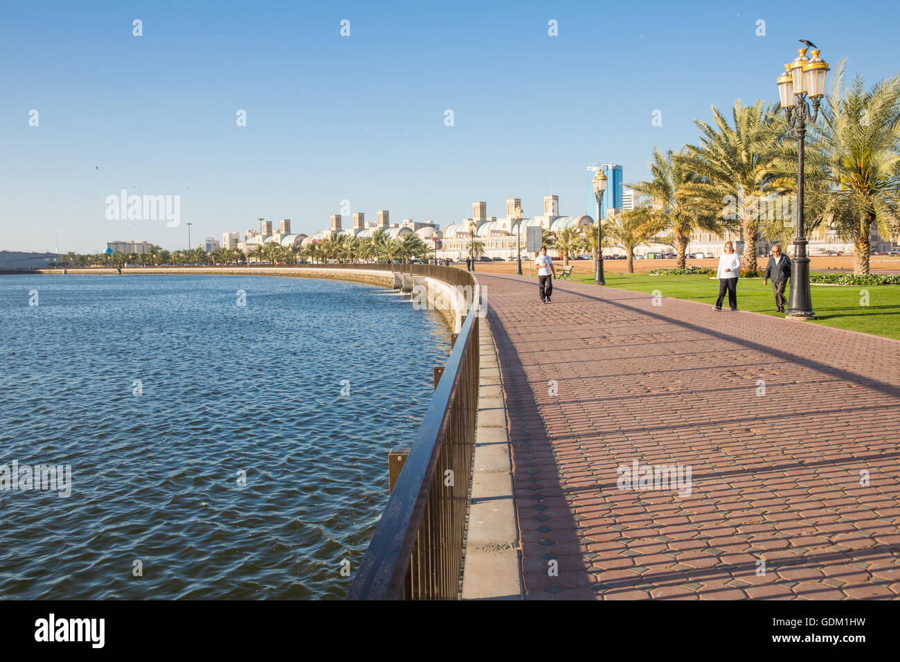 People strolling around Sharjah Corniche in Sharjah, UAE Stock Photo ...