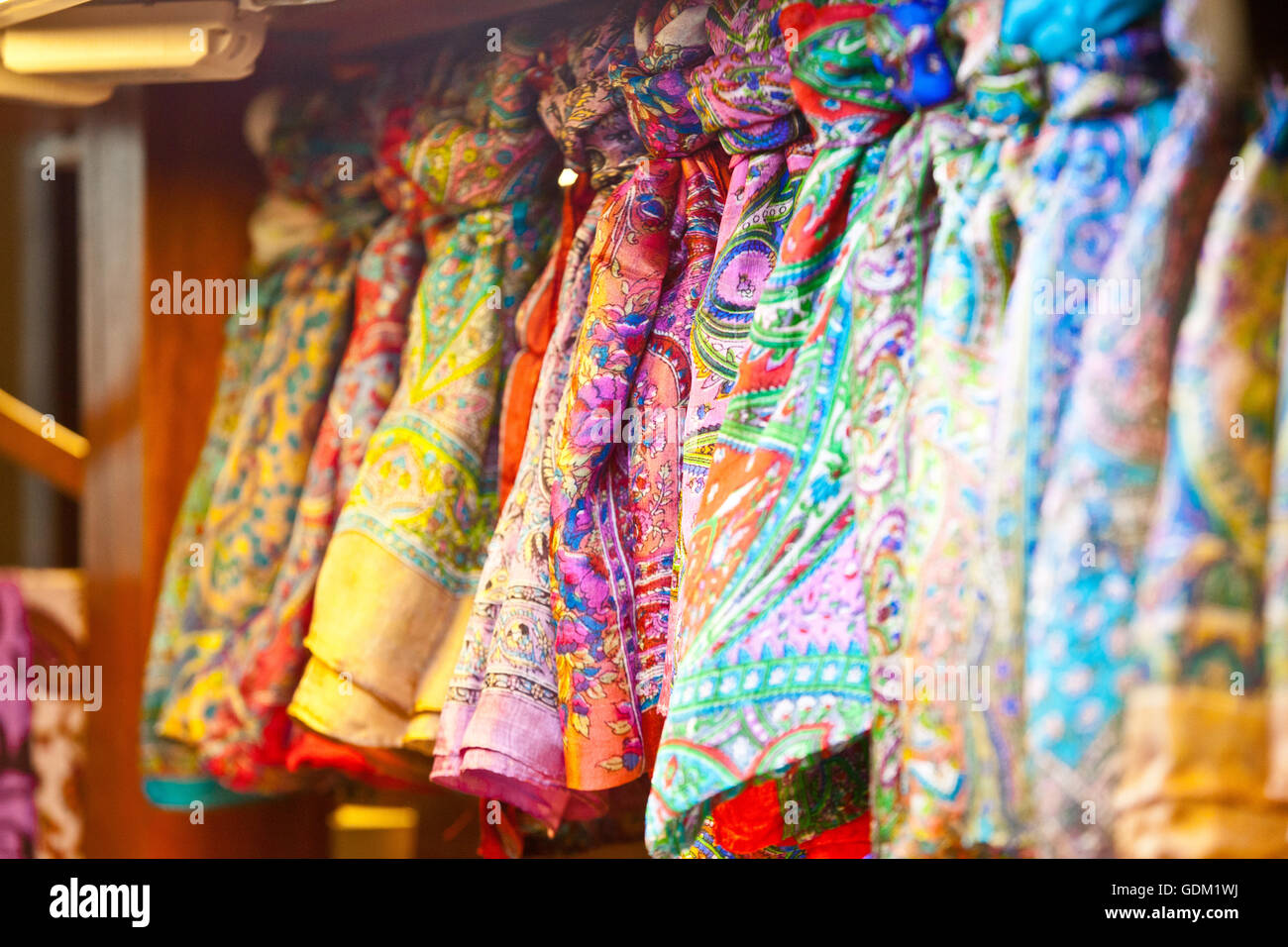 Scarves hanging from a rail, Dubai, UAE Stock Photo - Alamy