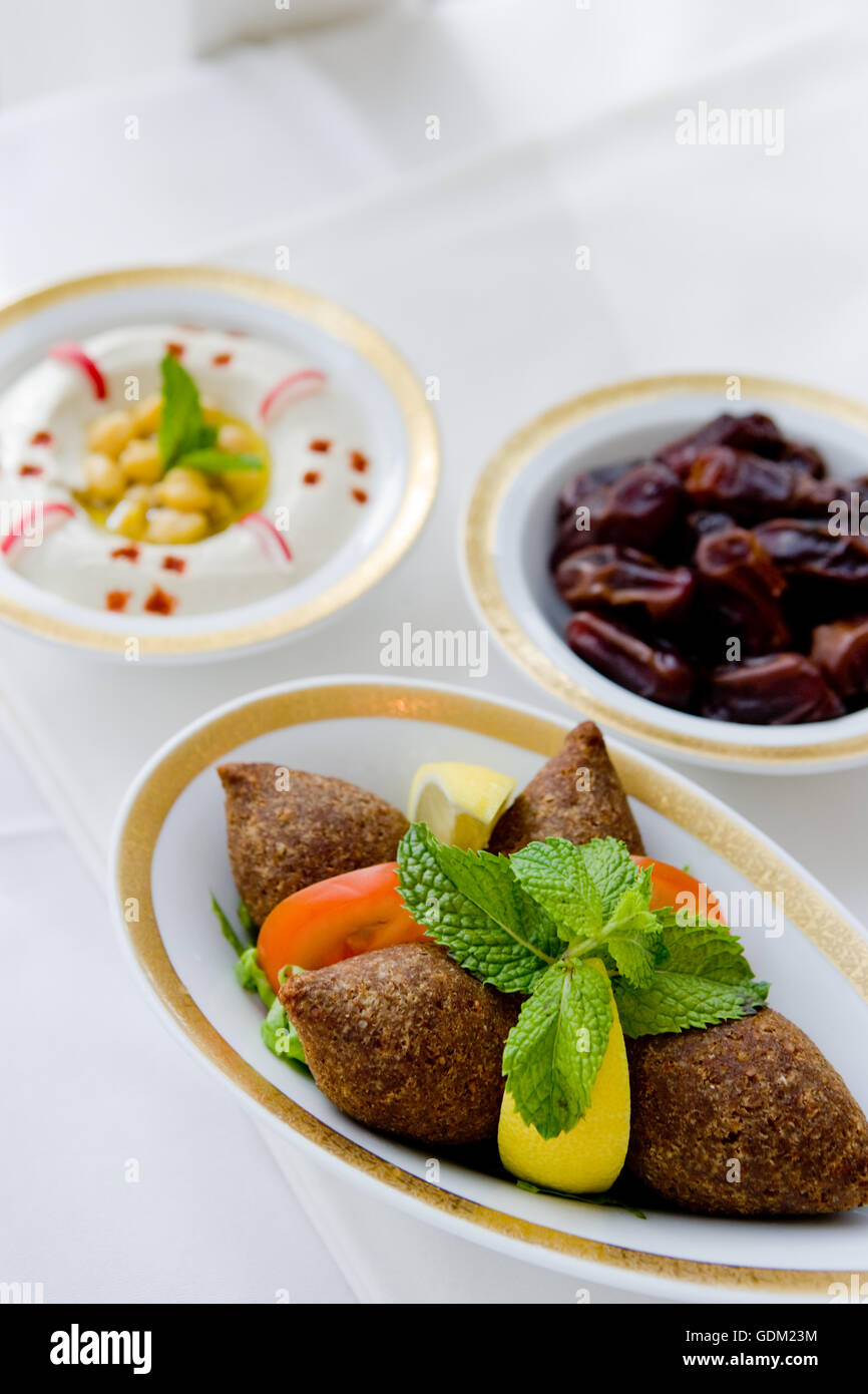 Kibbeh, Hummus and Dates served in bowls, Dubai, UAE Stock Photo - Alamy