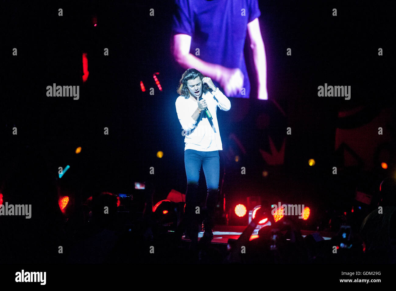Harry Styles of One Direction performing on stange during the concert ...
