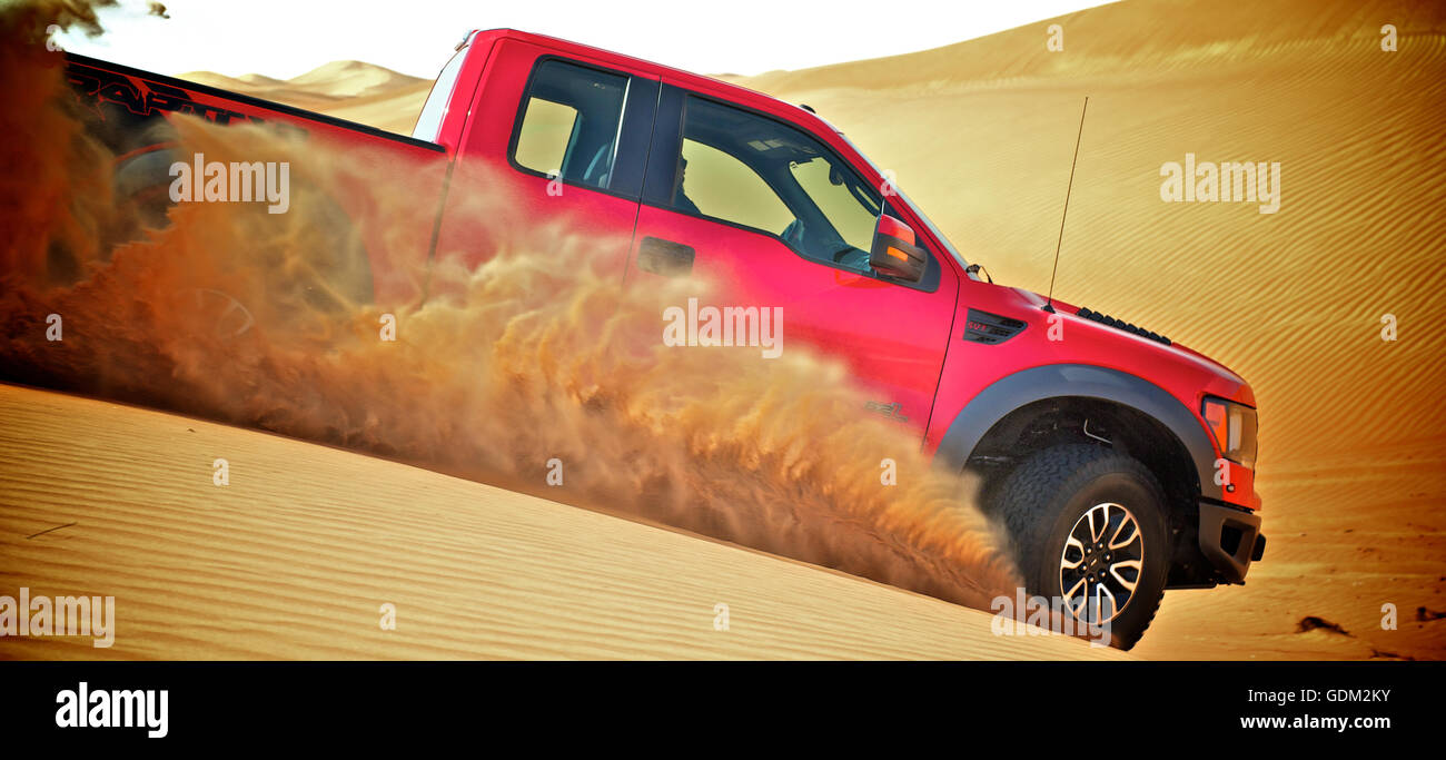 A Ford Raptor SVT pick-up drives in the sand dunes Stock Photo - Alamy