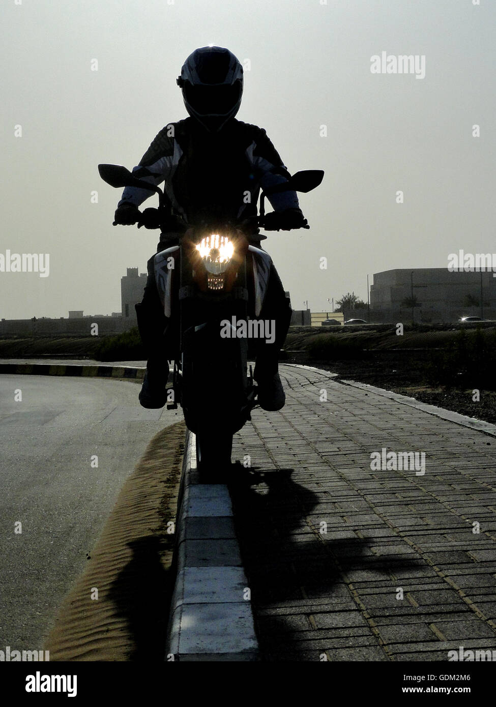 A motorcycle with day-light illuminated Stock Photo - Alamy
