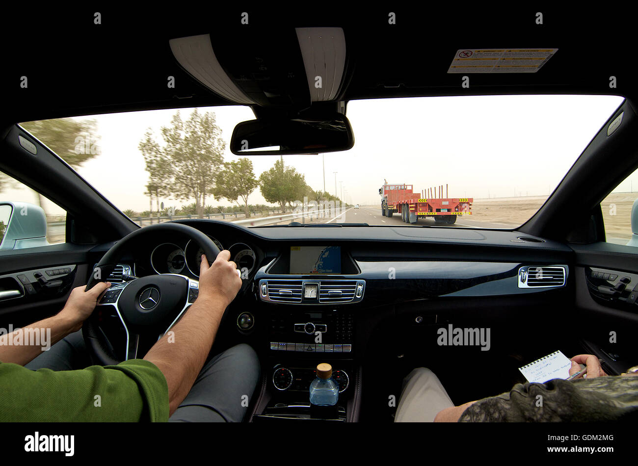 Interior view of a car dashboard and driver on the road Stock Photo - Alamy