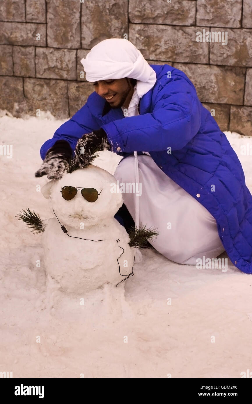 Emirati making a snowman in the Ski Dome in Mall of Emirates. Dubai ...