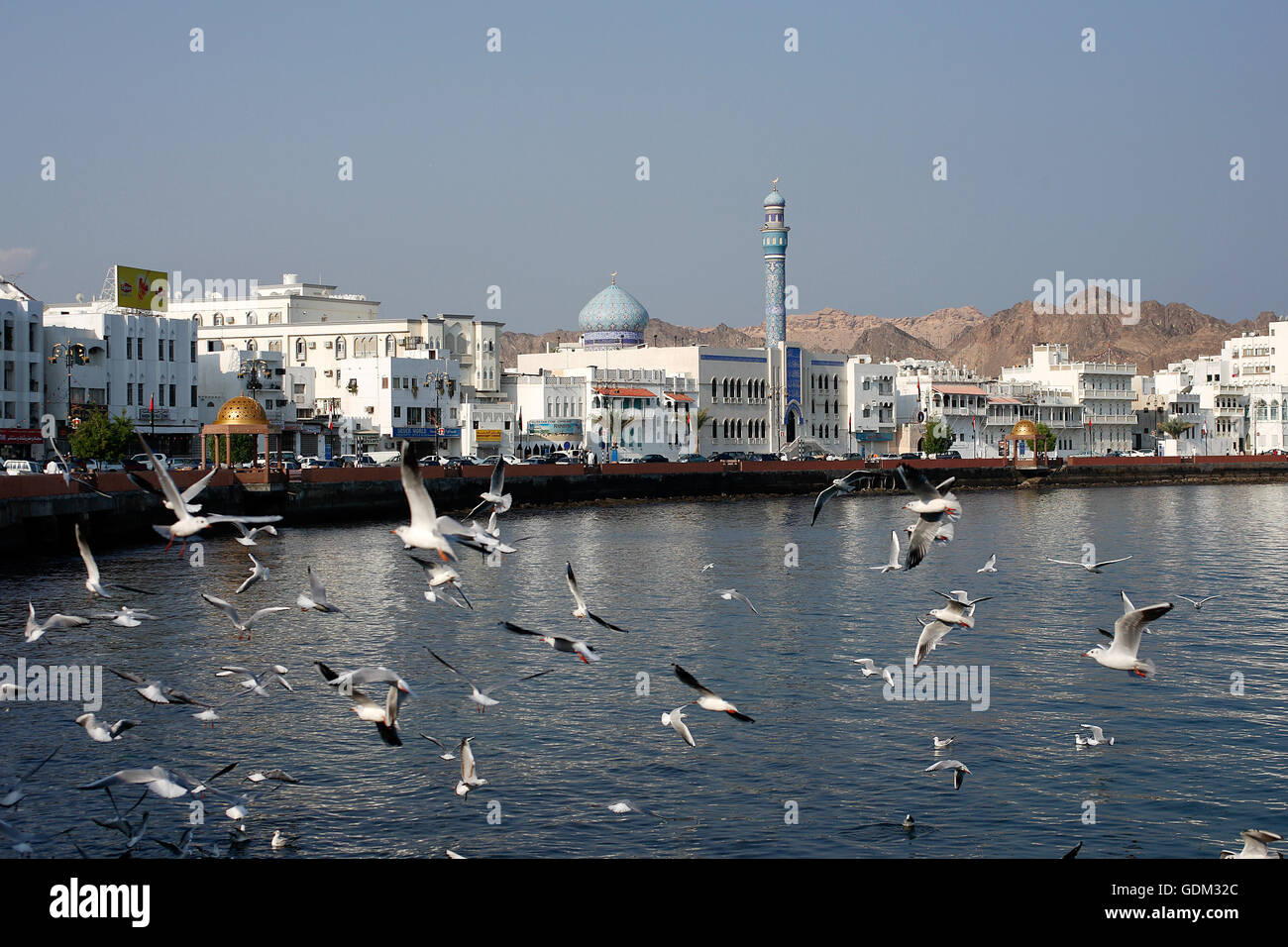 Mutrah port with persian style mosque. Muscat, Oman Stock Photo - Alamy
