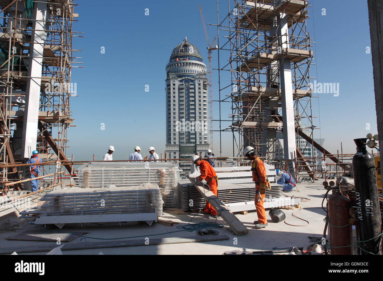 Infinity towers construction site in Dubai Marina with Palm Jumeirah in ...