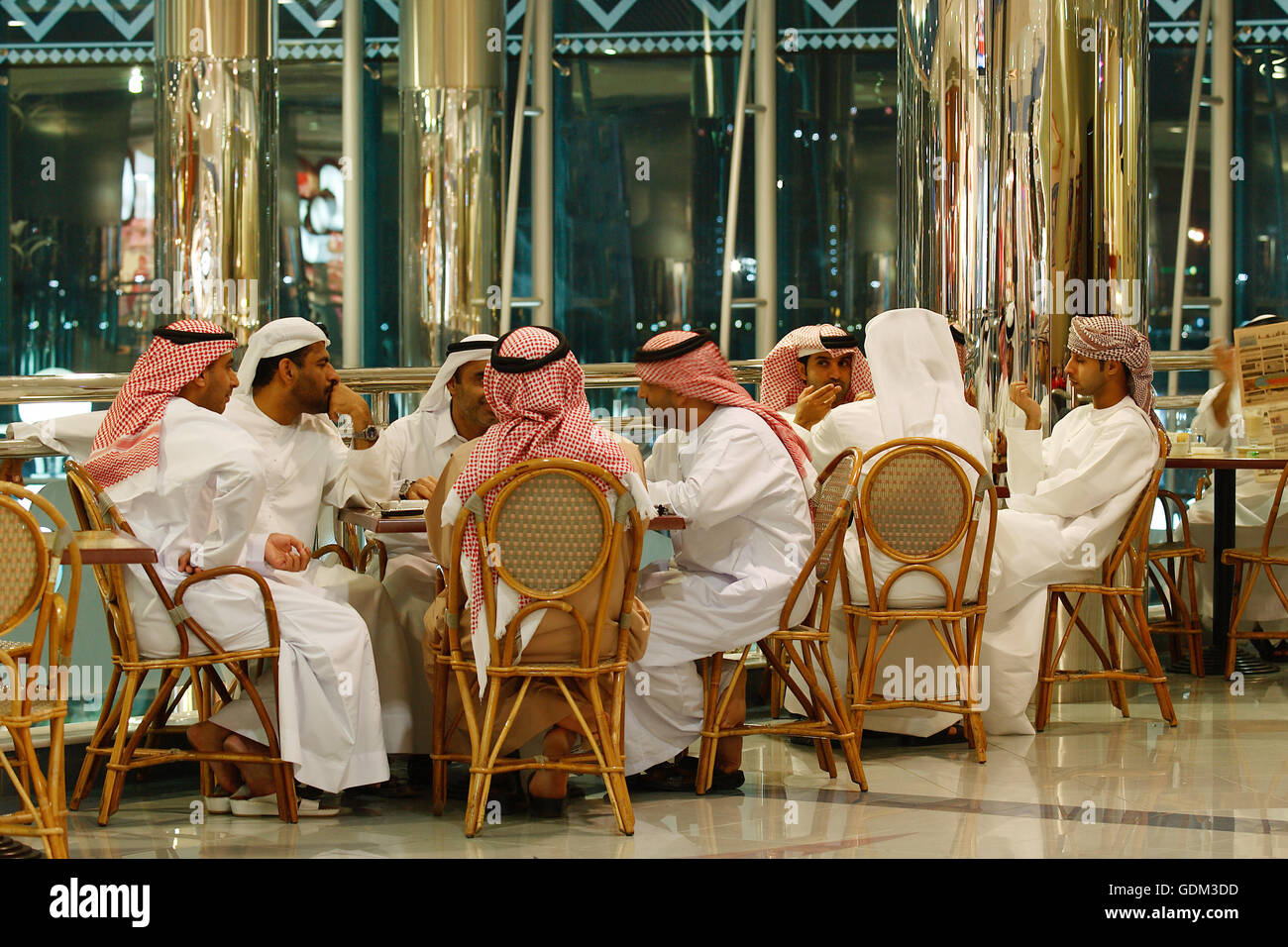 Emirati men sitting at a restaurant in Abu Dhabi, UAE Stock Photo - Alamy