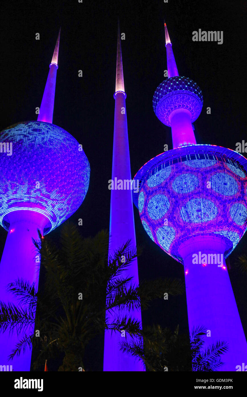 Kuwait Towers with animated graphics light at night Stock Photo - Alamy