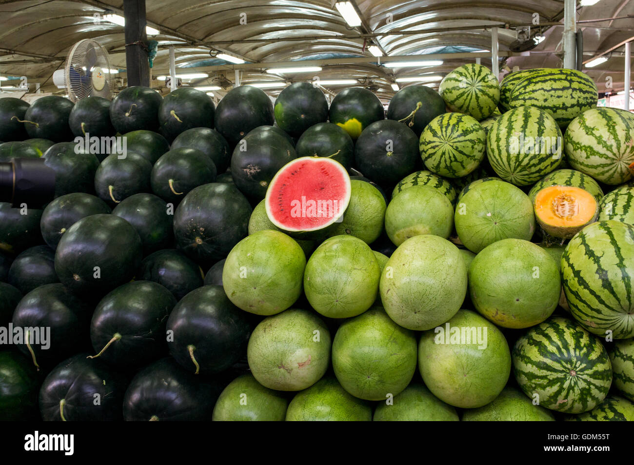 Stall full of fresh and ripe watermelon at a fruit and vegetable market ...