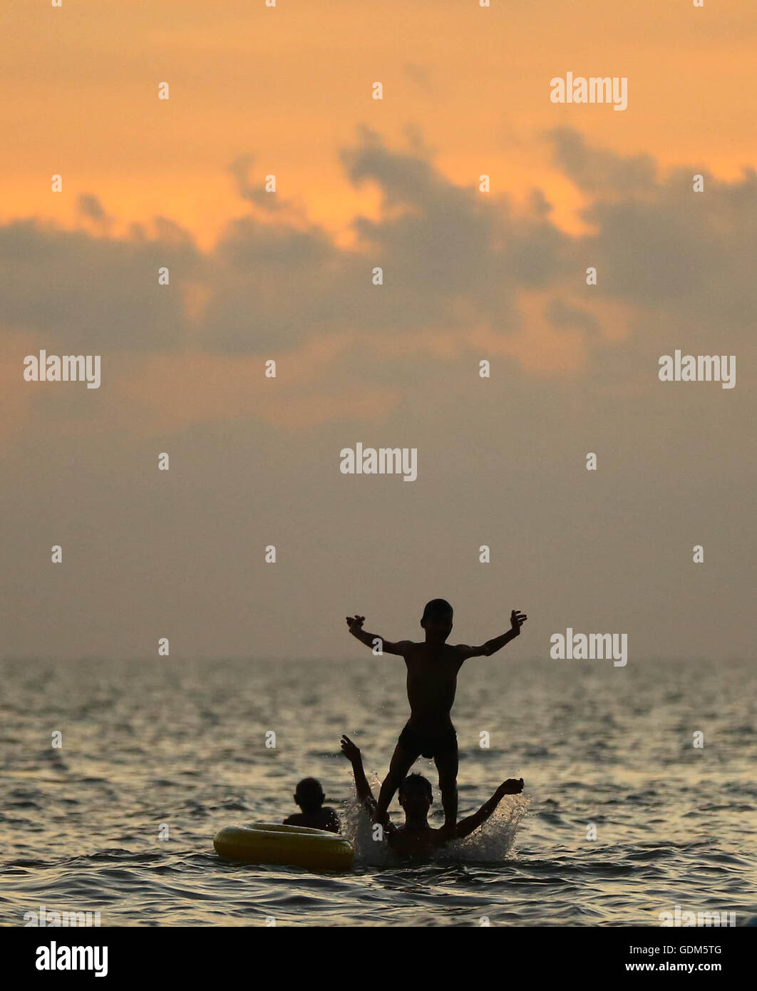 Sanya, China's Hainan Province. 17th July, 2016. People play in water ...