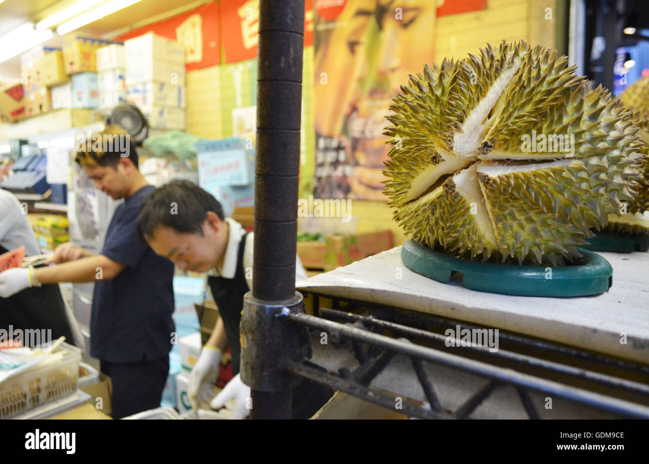 Tokyo, Japan. 17th July, 2016. Japanese fruit store employees work near ...