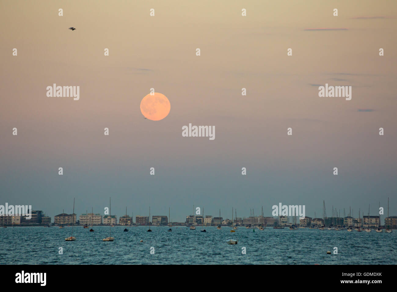 Poole, Dorset, UK. 19 July 2016 UK weather: full moon over Poole bay on ...