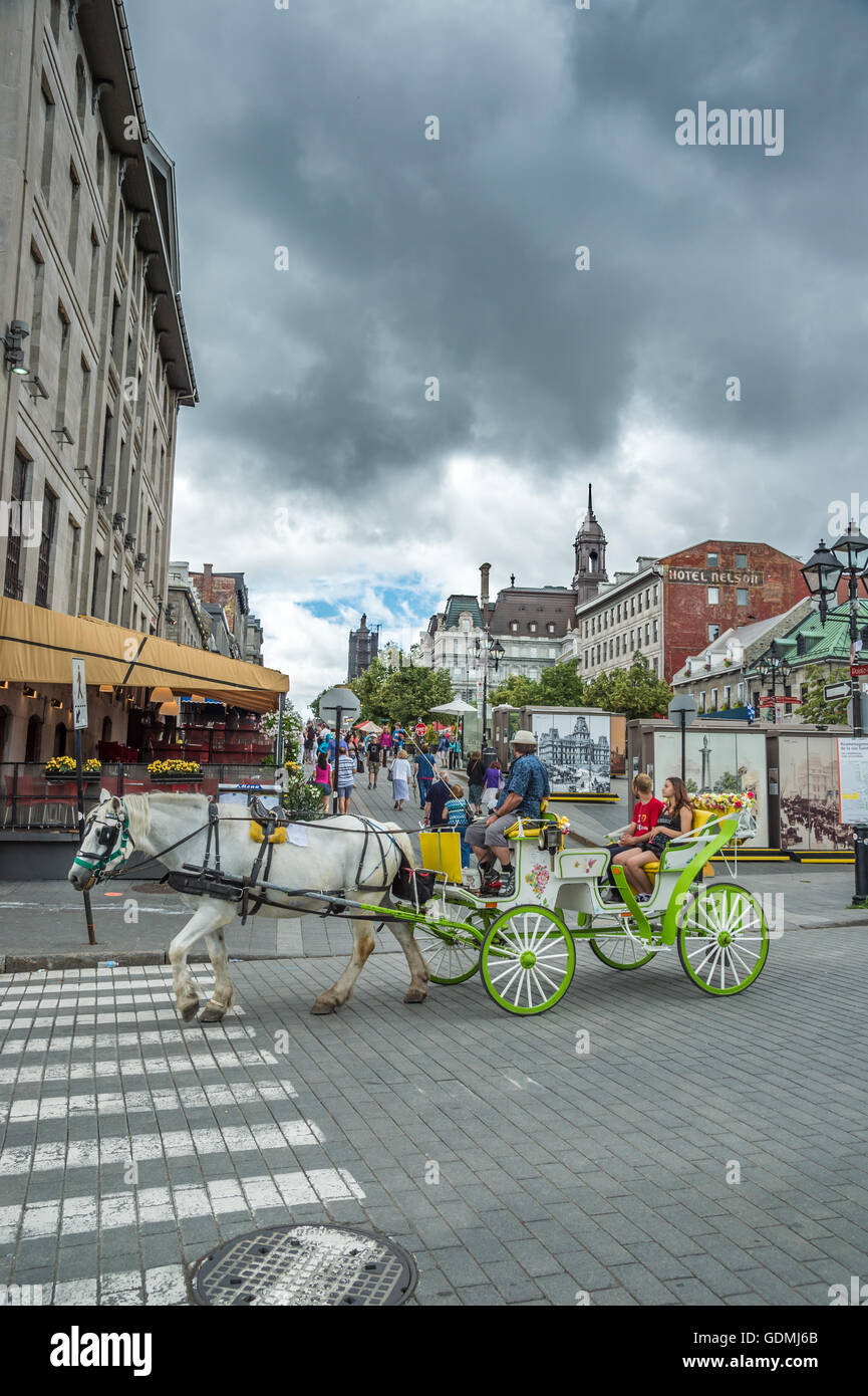 Tourists enjoy a caleche ride in Old Montreal (2016 Stock Photo - Alamy