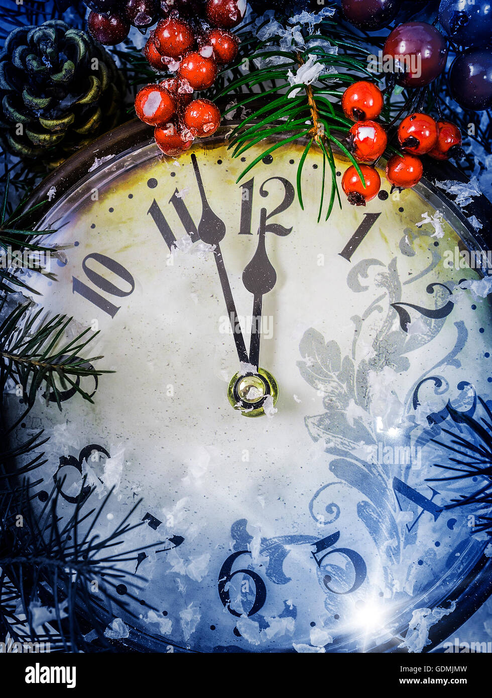Christmas Eve and New Years at midnight. Clock covered with snow at ...