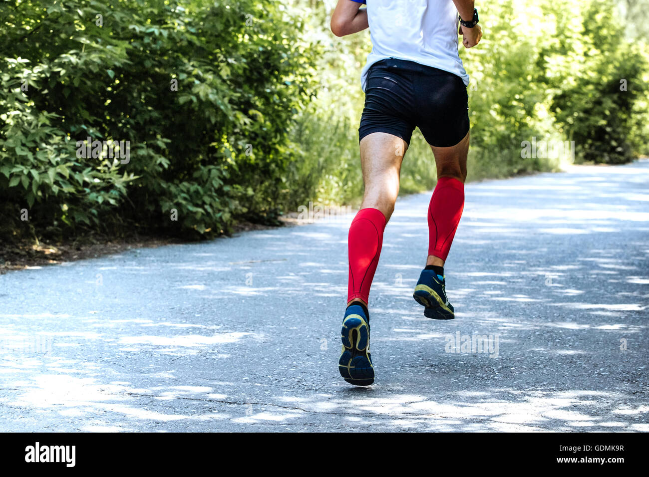 back view of running young male athlete during marathon Stock Photo - Alamy