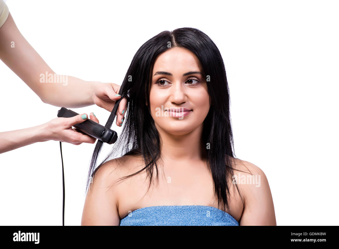 Young woman getting hair straightner isolated on white Stock Photo - Alamy
