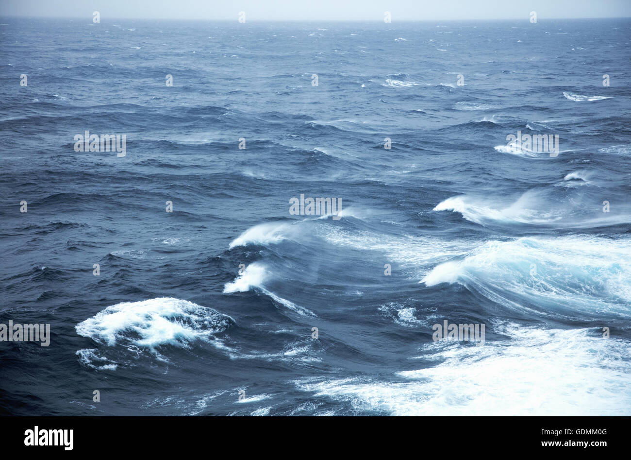 Strong winds whip up the sea in mid Atlantic Ocean Stock Photo - Alamy