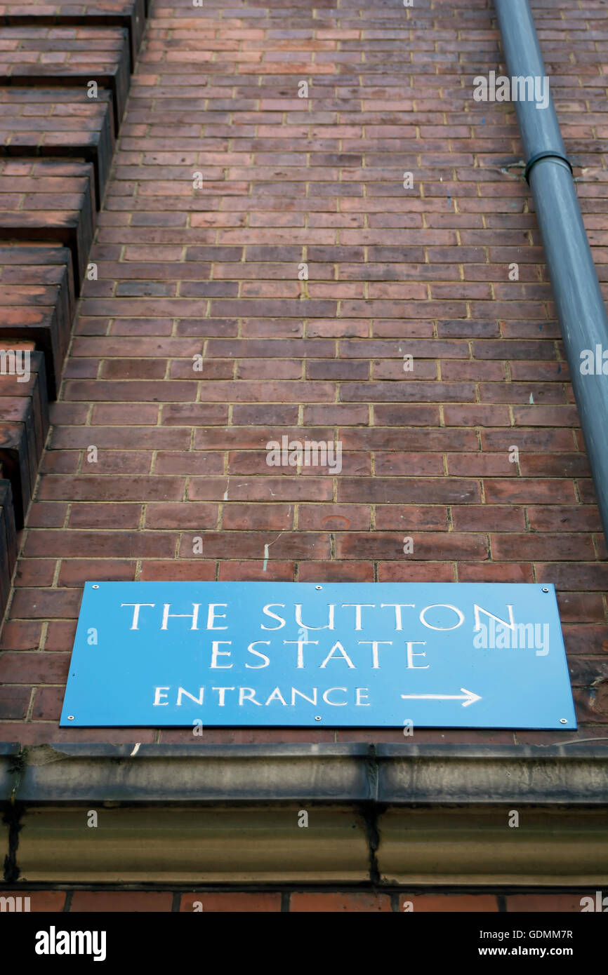 wall sign showing direction to the entrance to the 1913 sutton estate ...
