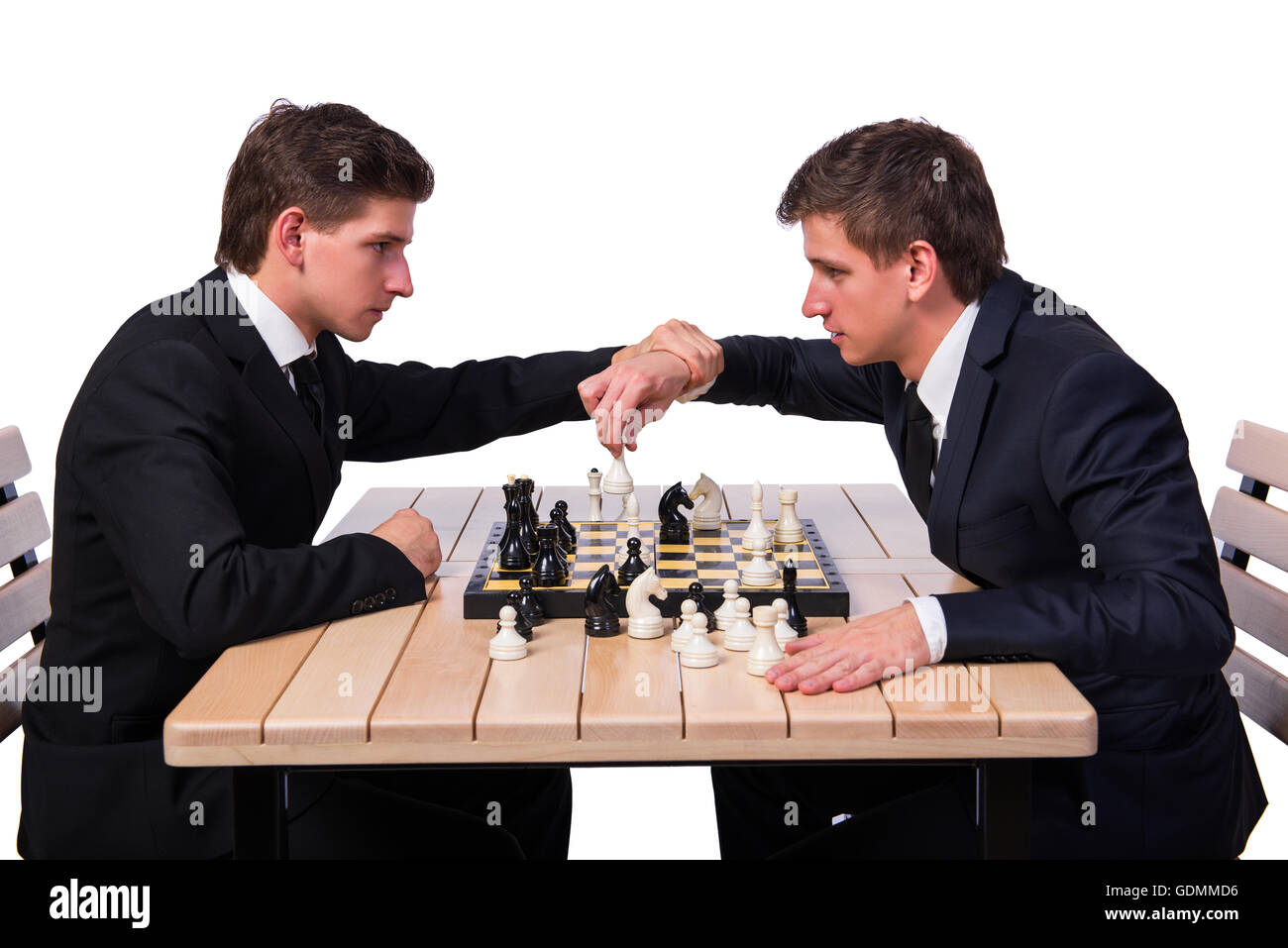 Twin brothers playing chess isolated on white Stock Photo - Alamy