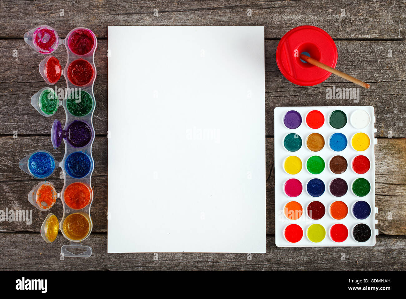 Watercolor paints set with brushes and paper sheet Stock Photo - Alamy