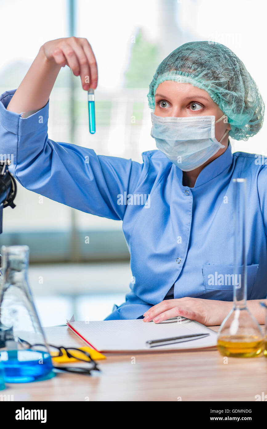 Experienced lab assistant working on chemical solutions Stock Photo - Alamy