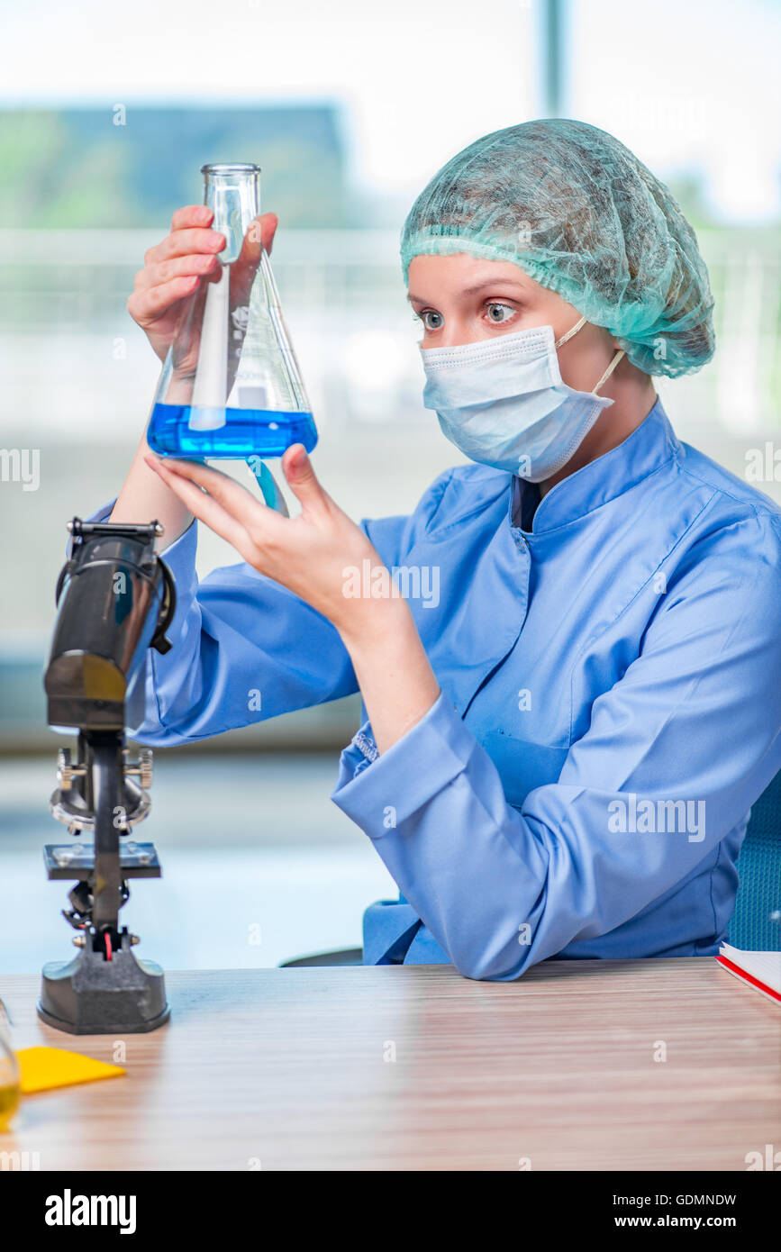 Experienced lab assistant working on chemical solutions Stock Photo - Alamy