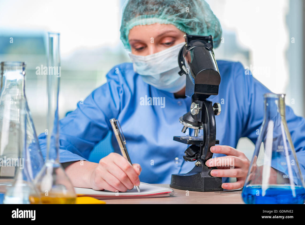 Experienced lab assistant working on chemical solutions Stock Photo - Alamy