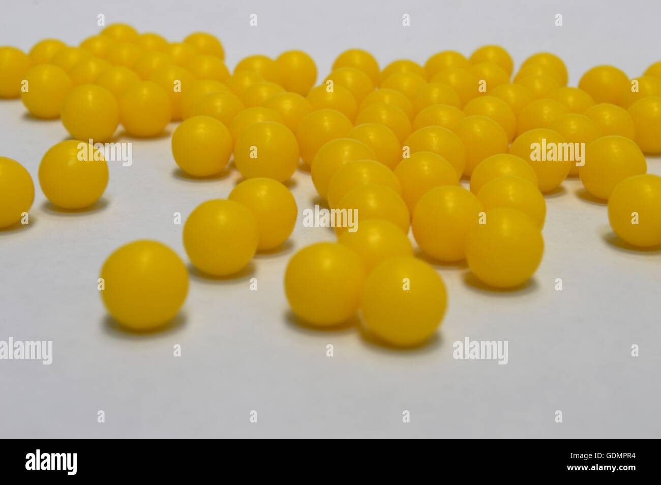 Yellow balls isolated Stock Photo - Alamy